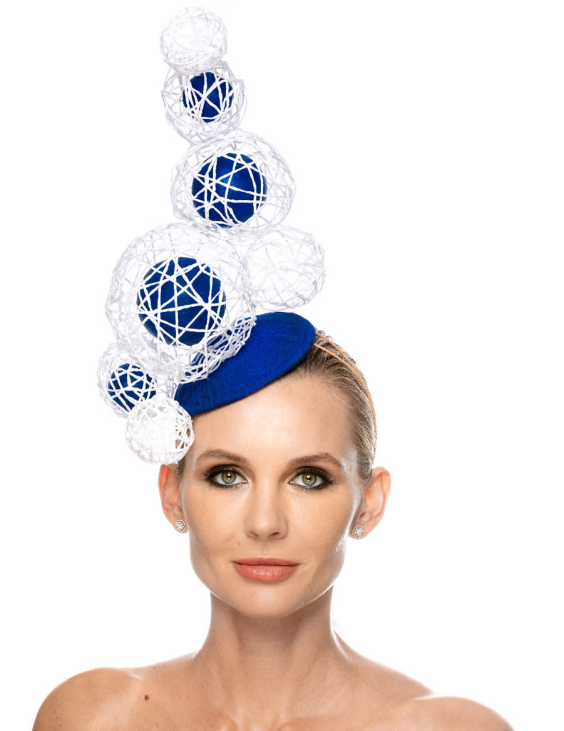 BLUE CAP WITH ORBITING BLUE AND WHITE BALLS - Shapoh